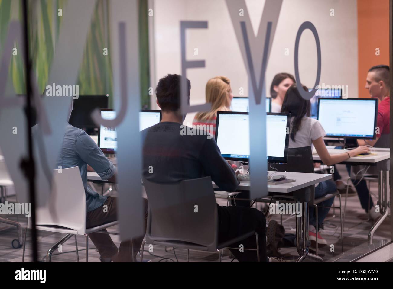 technology students group in computer lab school classroom working on ...