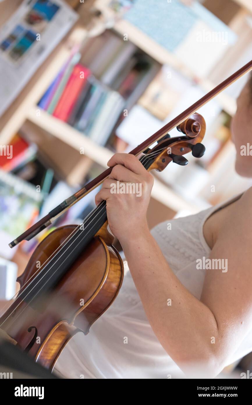 Pretty young girl practices on her violin, acoustic music Stock Photo ...