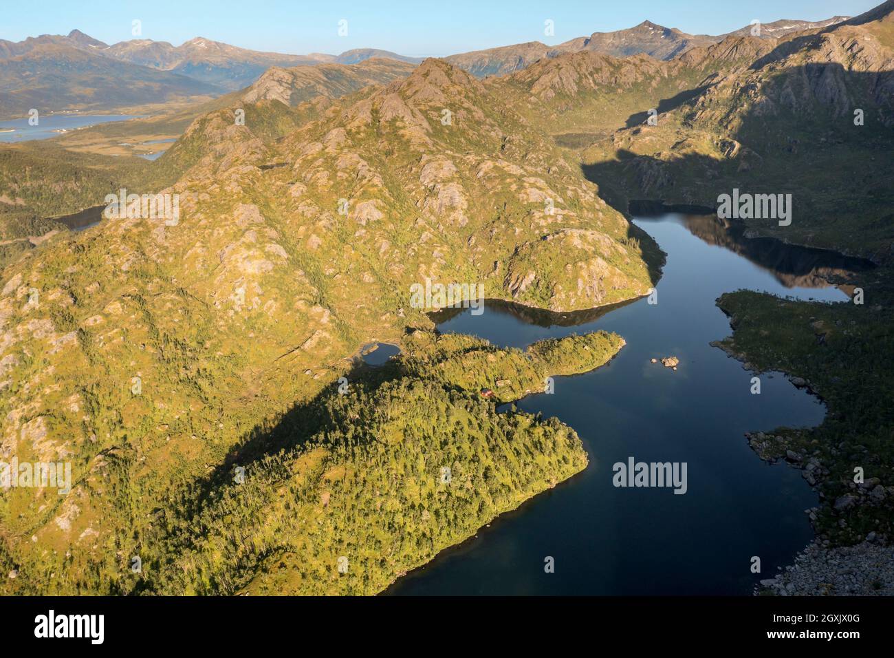 Aerial view of mountains and lake near mt. Sukkertoppen, the mountain ...