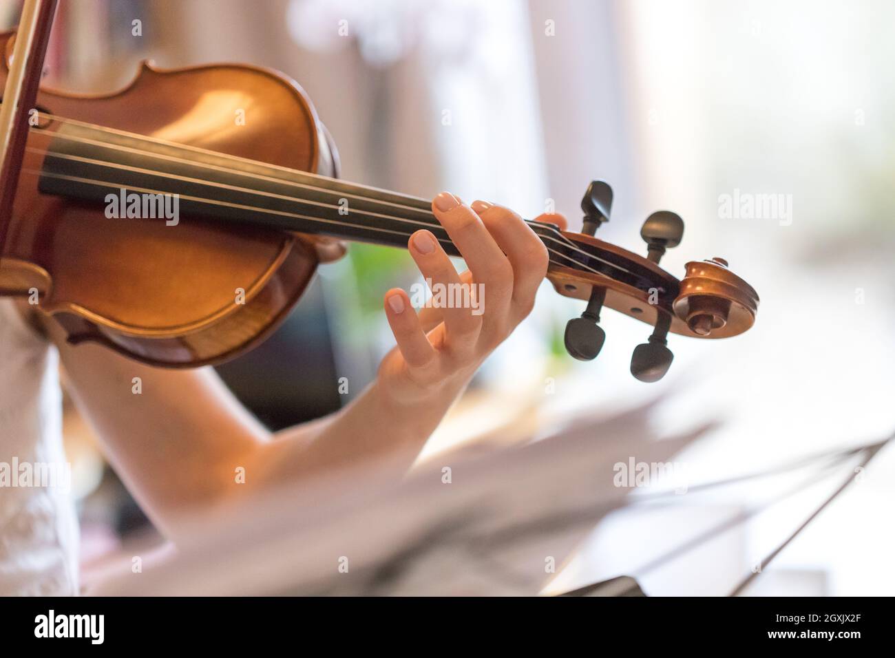 Pretty young girl practices on her violin, acoustic music Stock Photo ...