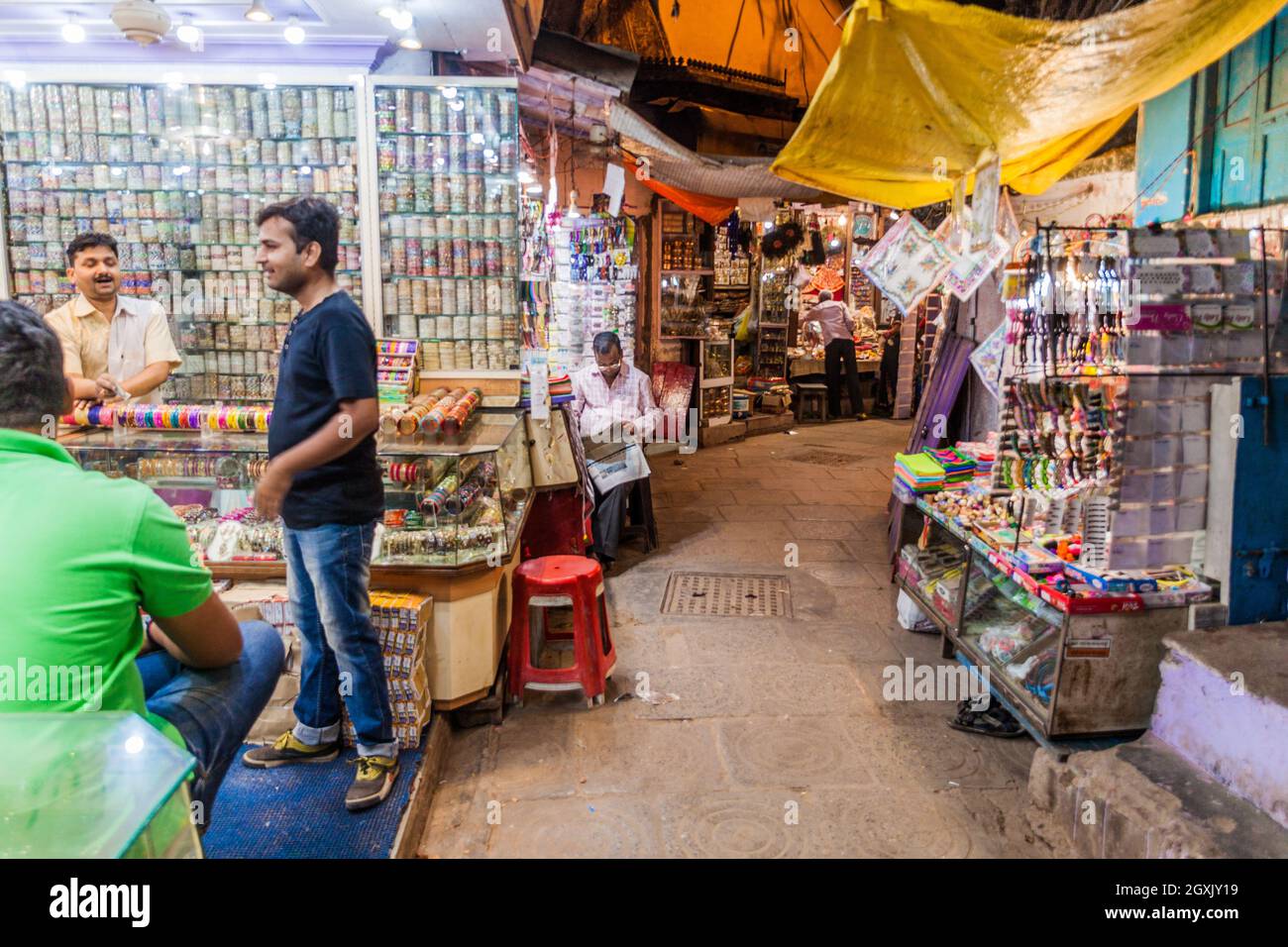 VARANASI, INDIA - OCTOBER 25, 2016: View of a narrow alley with street ...