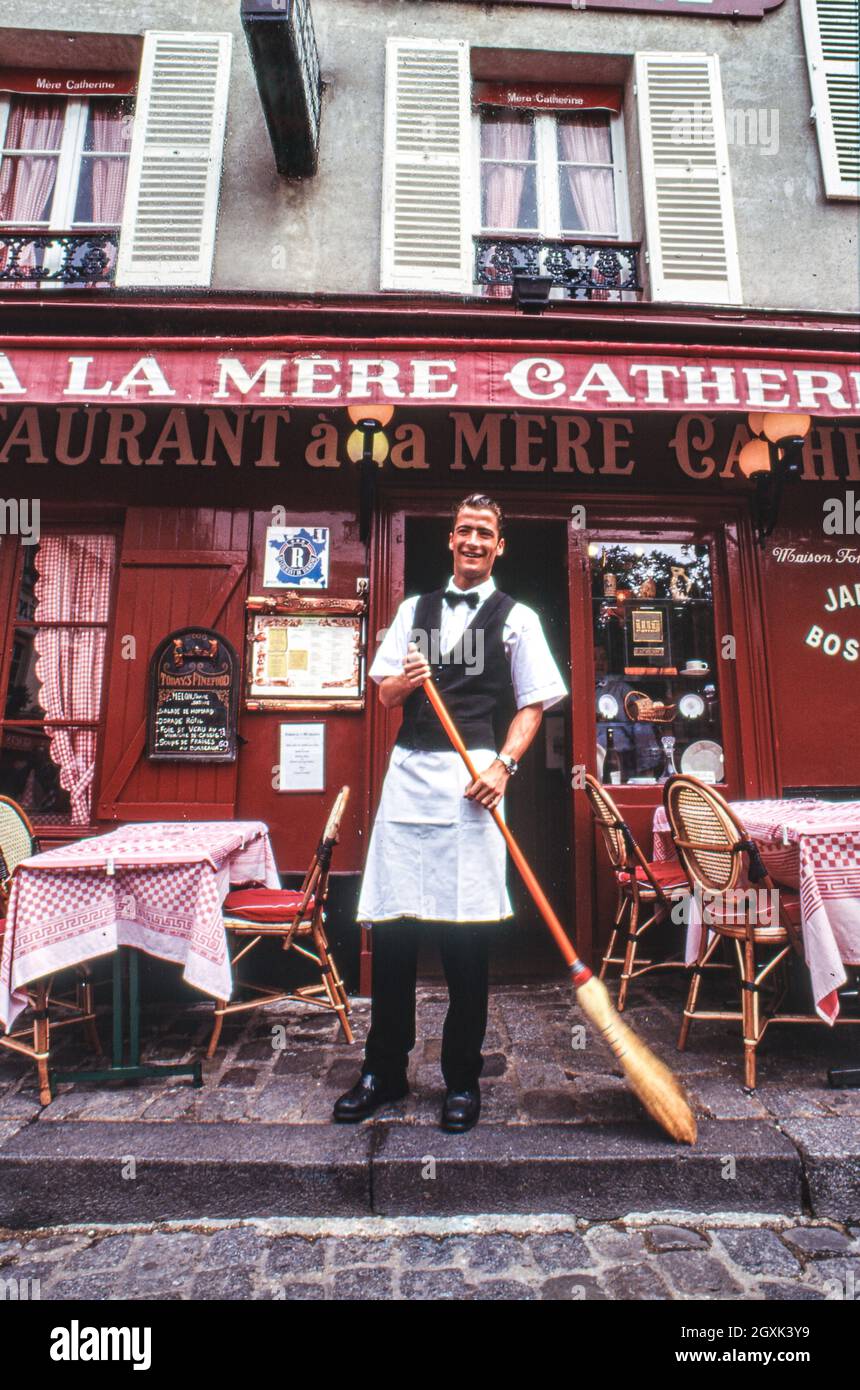 PARIS WAITER MONTMARTRE Classic French waiter, morning preparations at ...