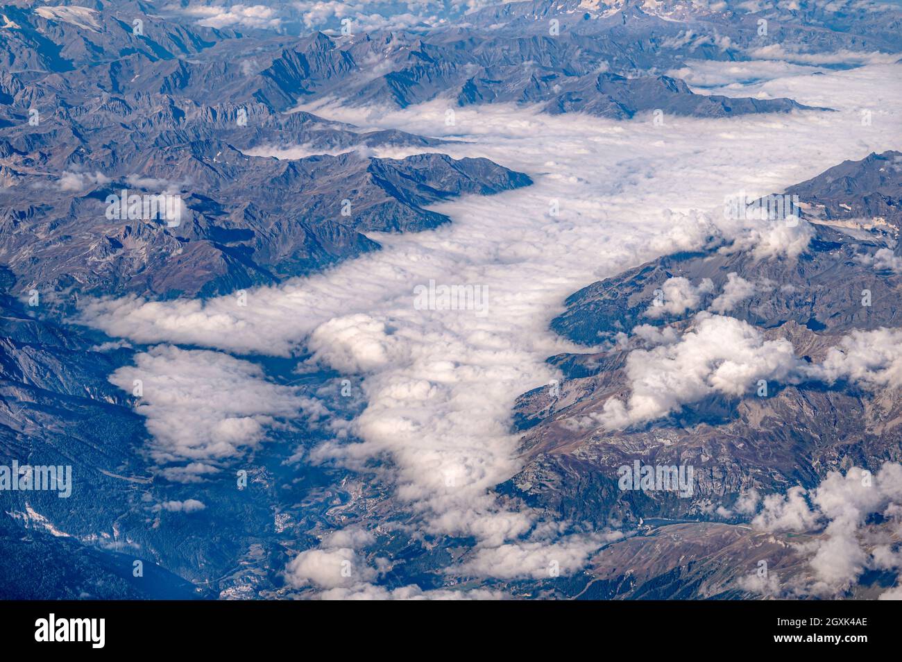 Aerial view of swiss alps. View of mountain and white cloud from the ...