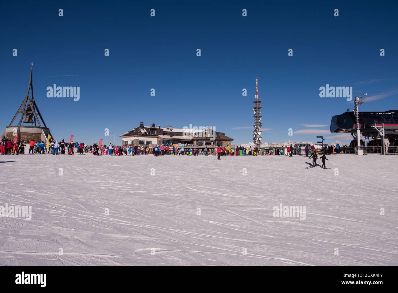 group of happy people having fun on snow during winter season at ...
