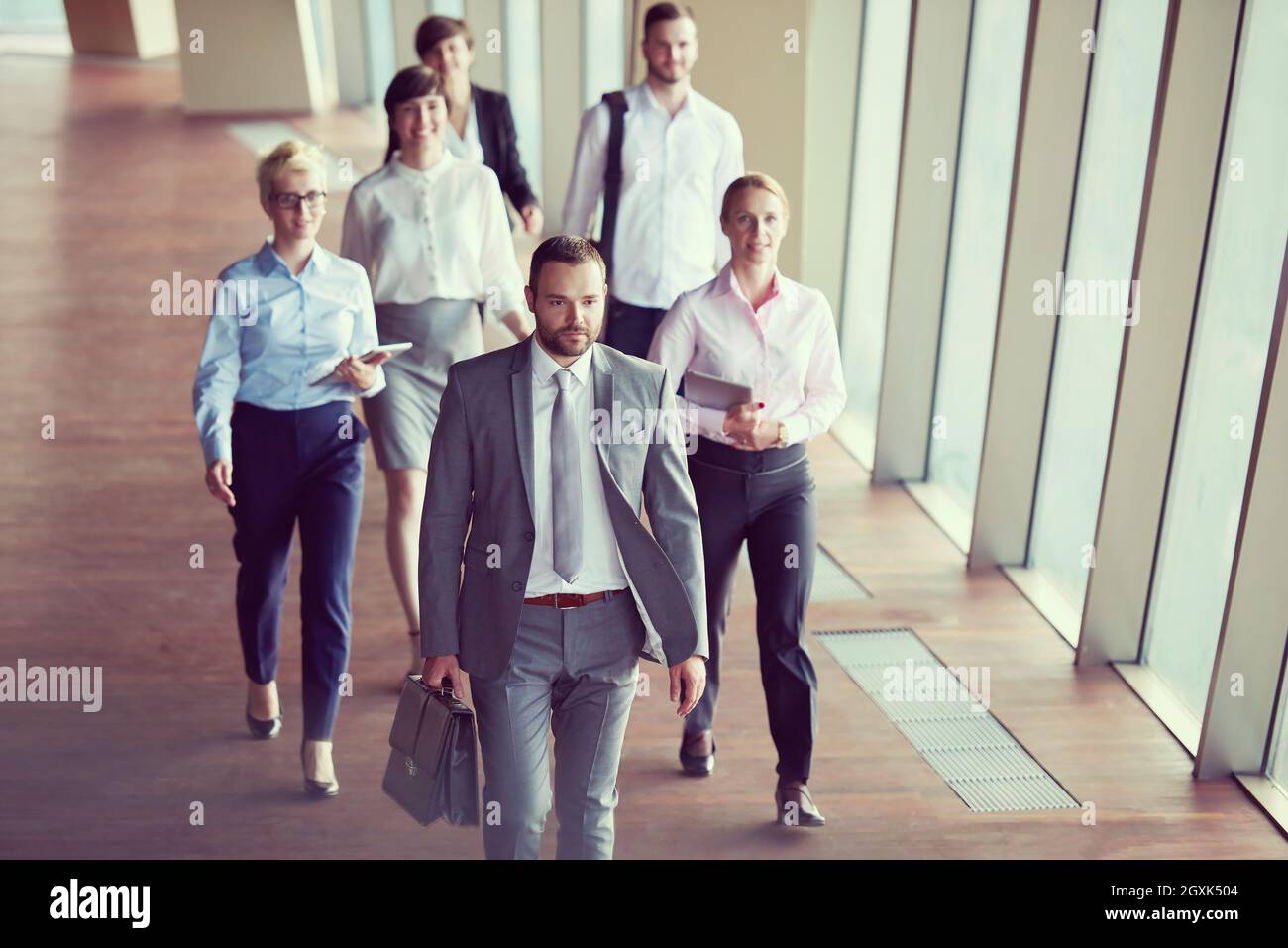 business team, businesspeople group walking at modern bright office ...