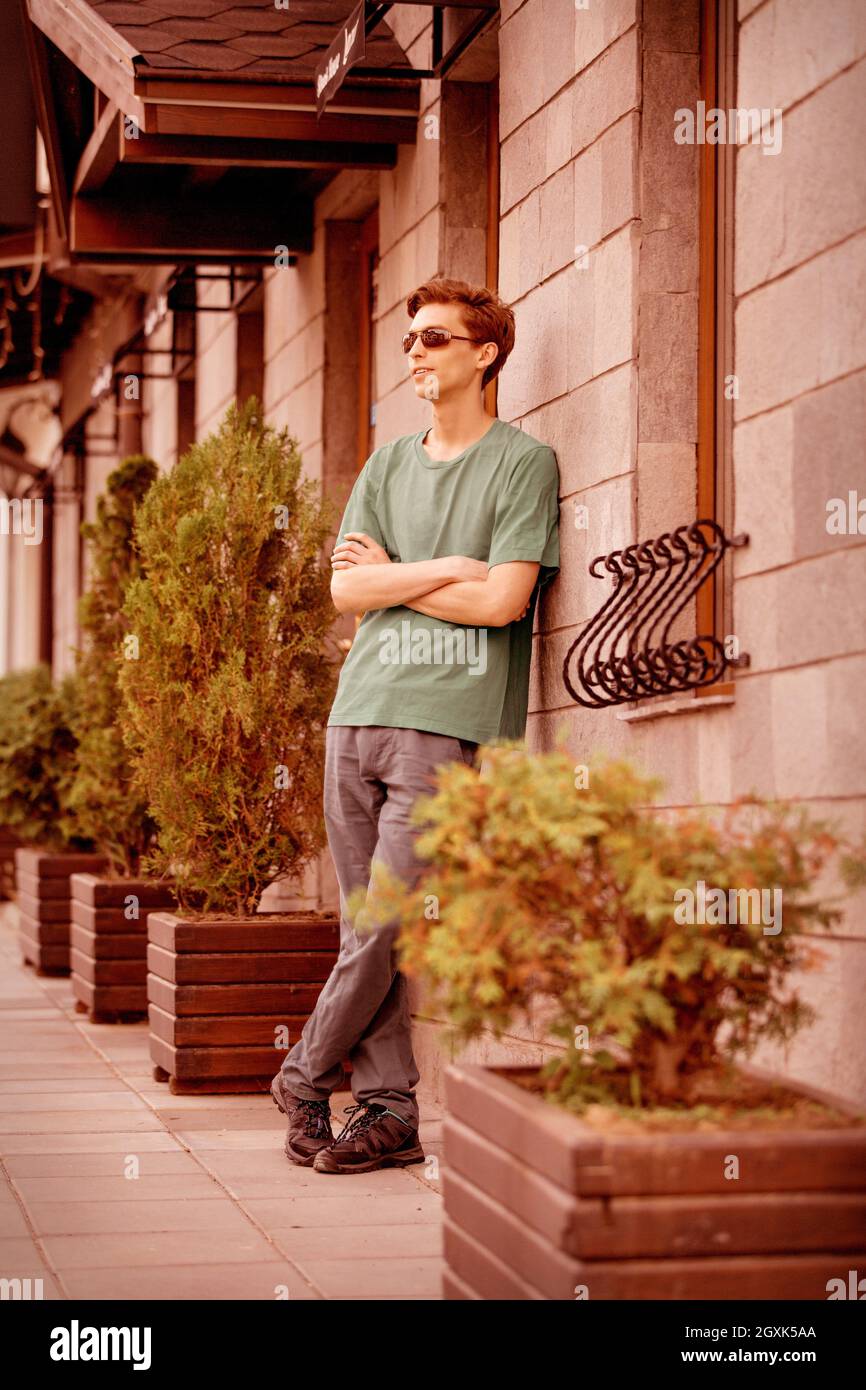 Red brick wall man standing hi-res stock photography and images - Alamy