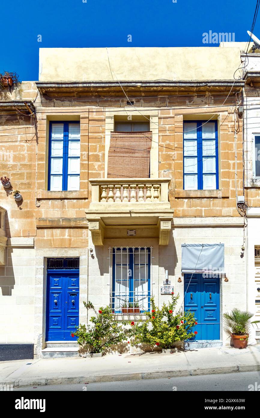 Typical Maltese residential architecture with brightly coloured timber ...