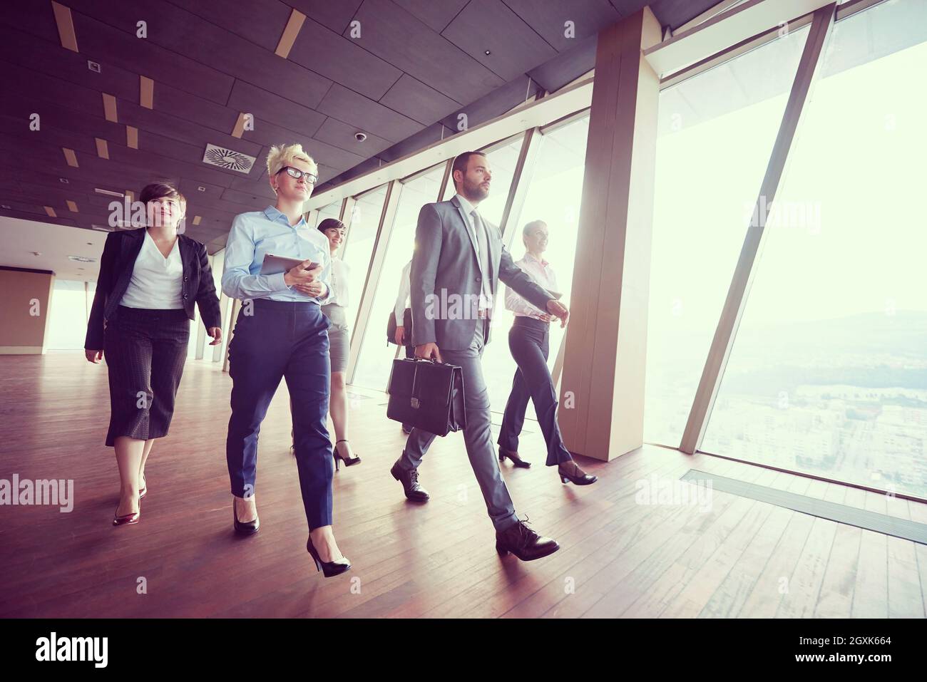 business team, businesspeople group walking at modern bright office ...