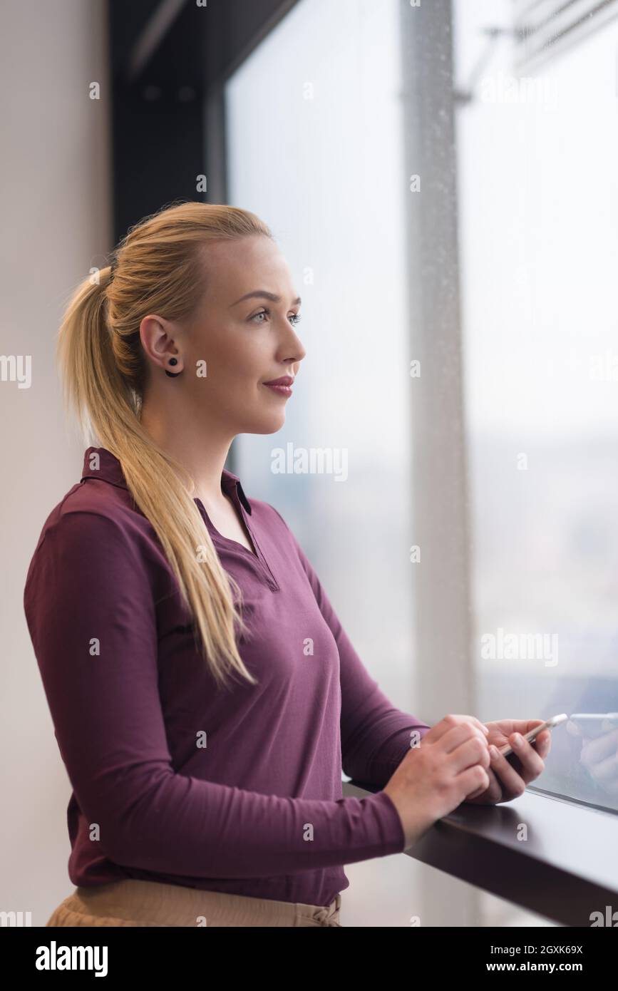 business woman at office using smart phone to check internet and type ...