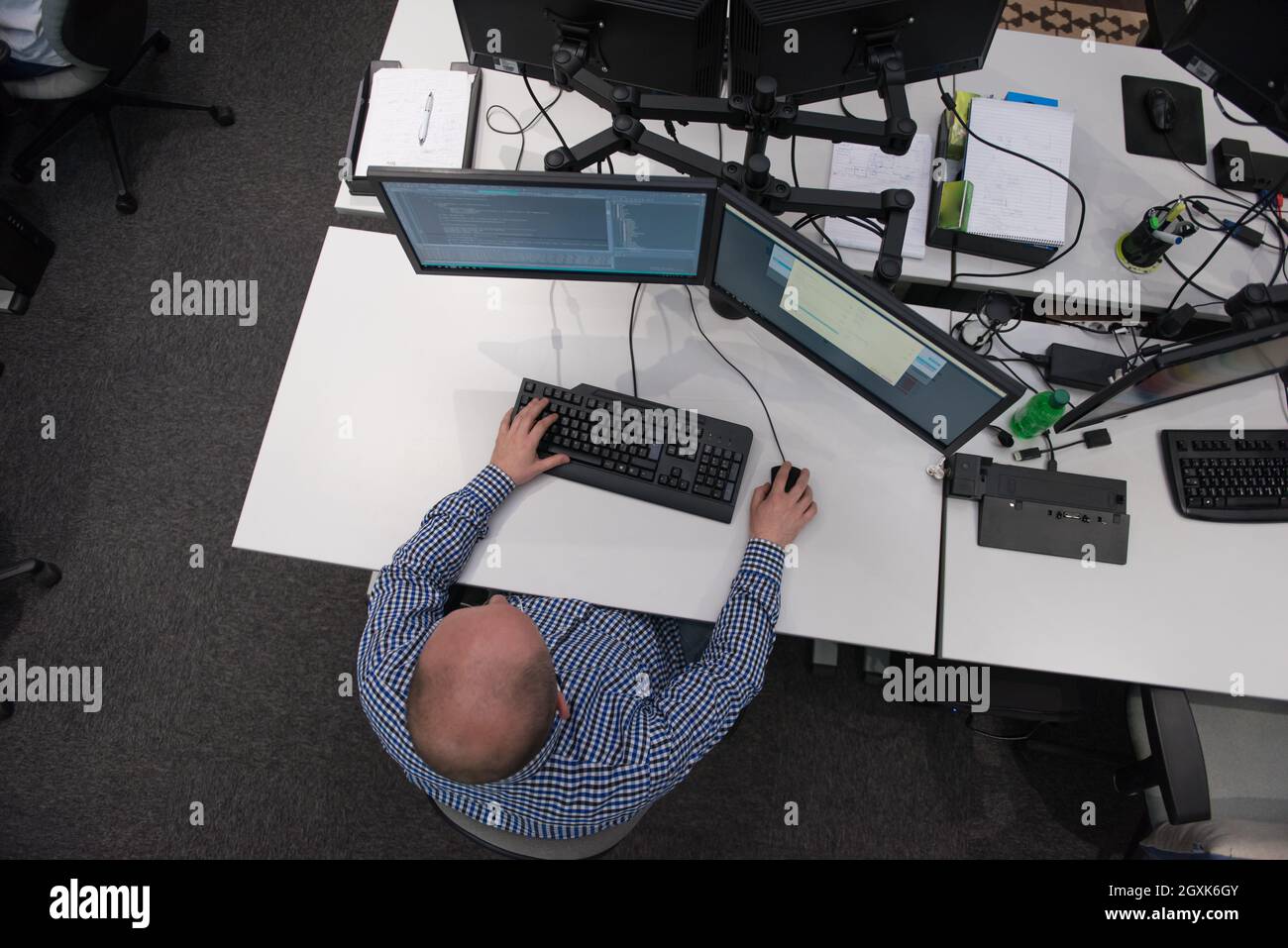 top view of software developer writing programming code on computer ...