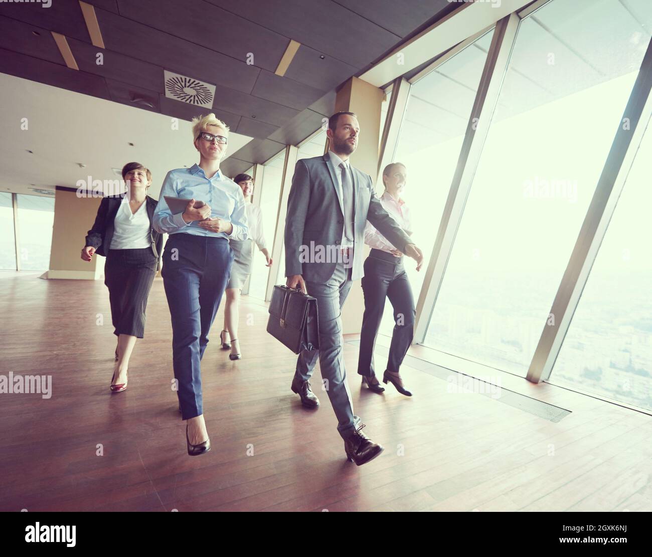 business team, businesspeople group walking at modern bright office ...