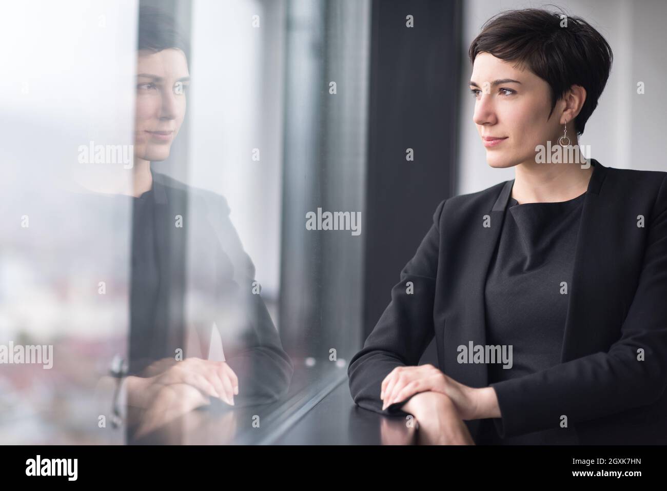 Portrait Of Successful Businesswoman by the window Entrepreneur At Busy ...