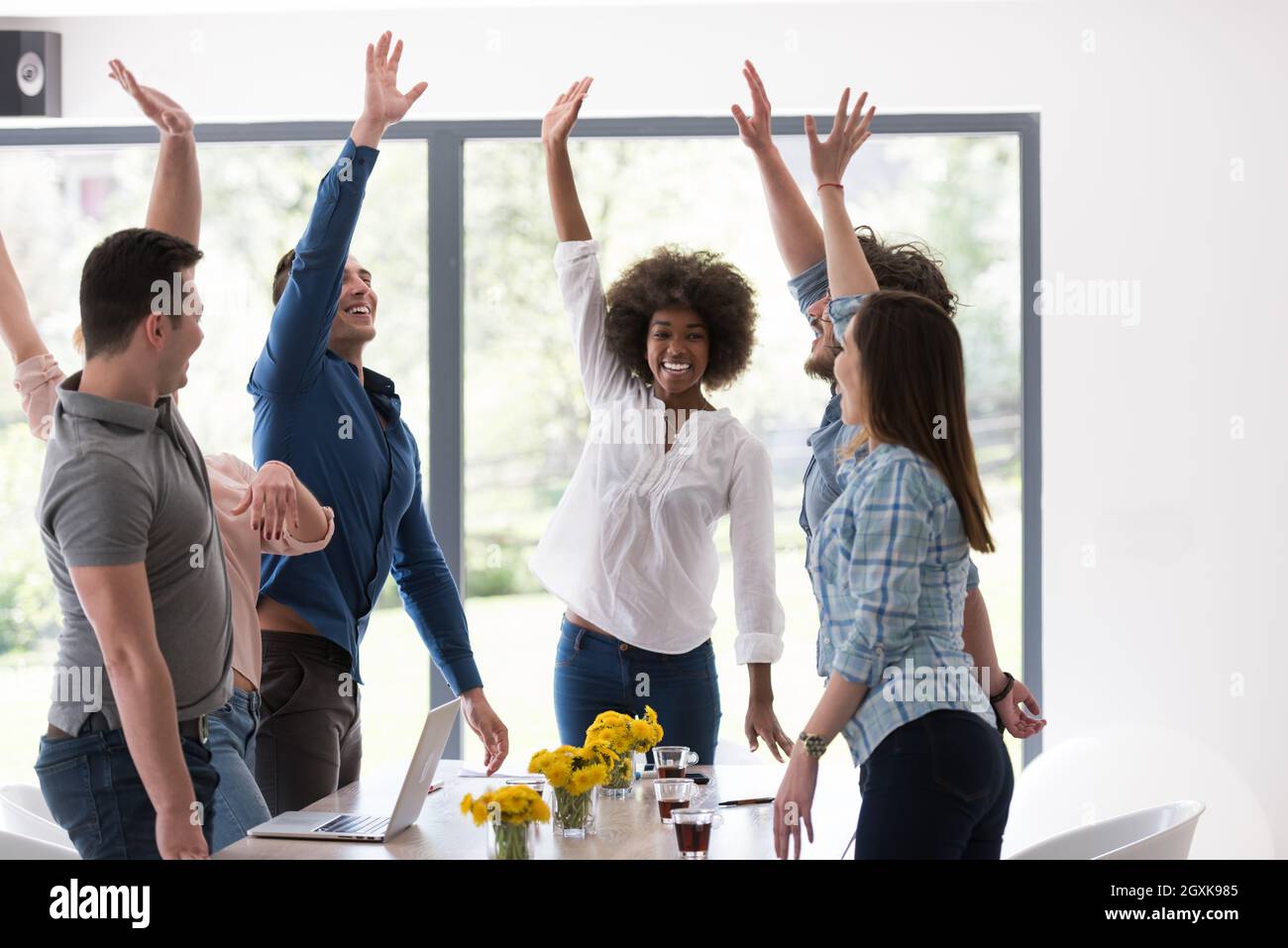 multiethnic Group of young business people looking happy while ...