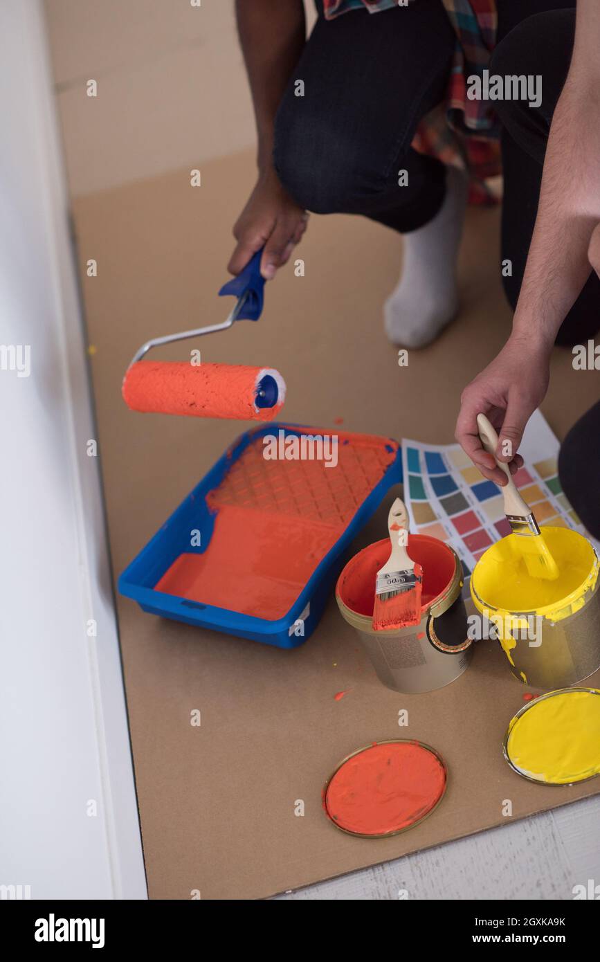 two painters prepare color for painting the wall Stock Photo - Alamy