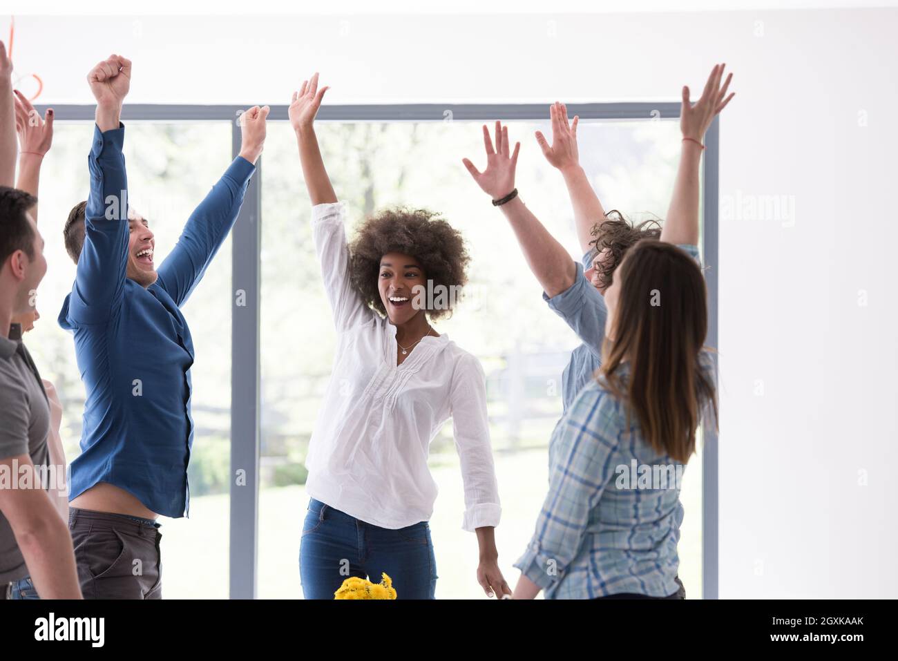 multiethnic Group of young business people looking happy while ...