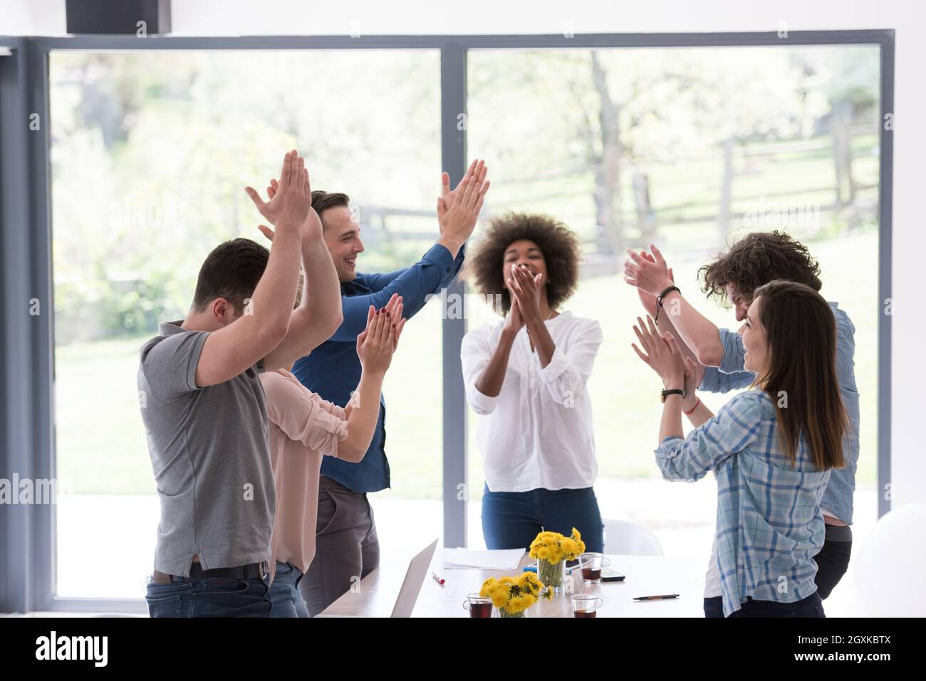 multiethnic Group of young business people looking happy while ...