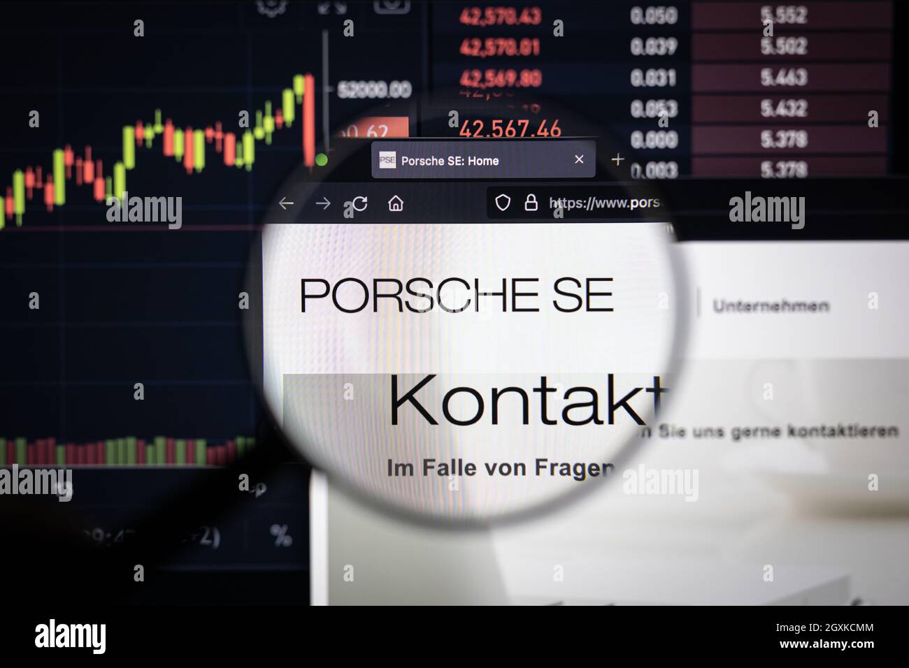 Porsche SE company logo on a website with blurry stock market ...