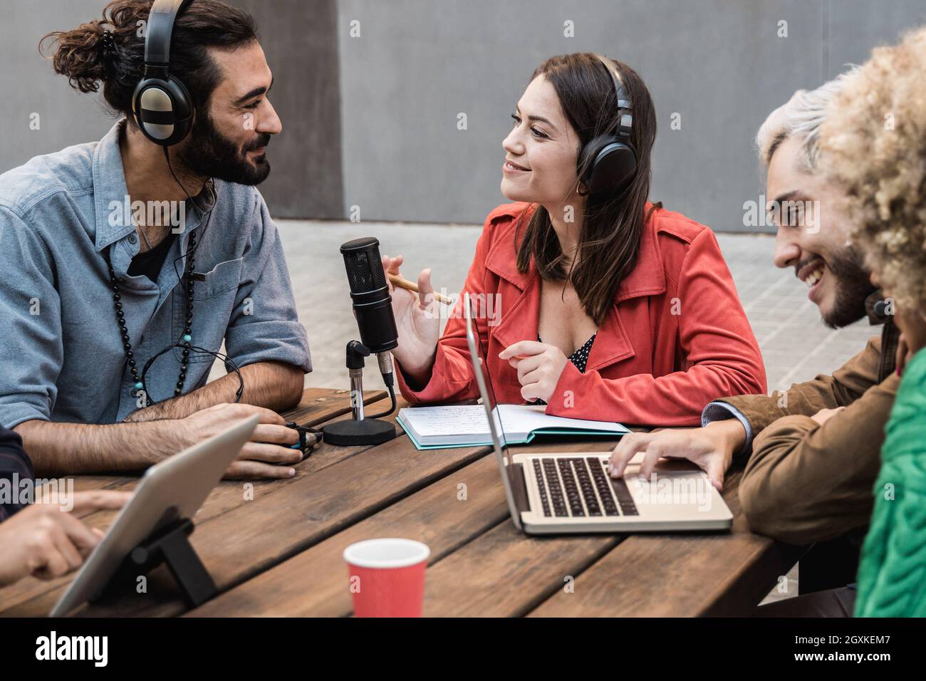 Group of people recording radio podcast together - Young friends ...