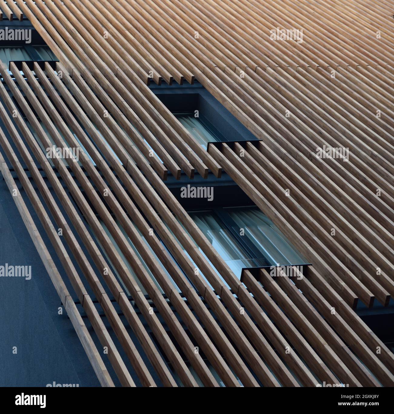 modern stripe wooden facade with windows Stock Photo - Alamy