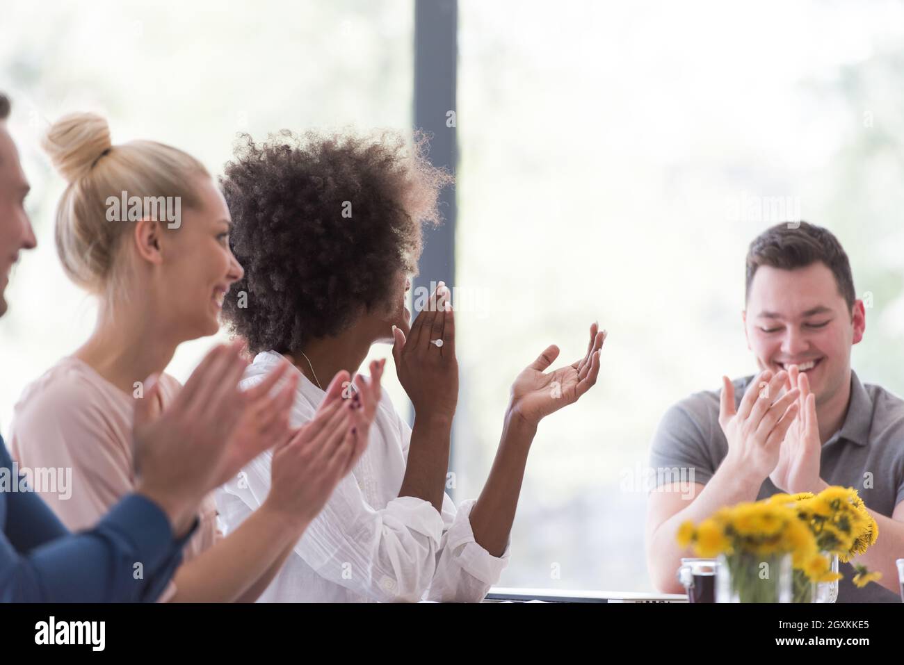 multiethnic Group of young business people looking happy while ...
