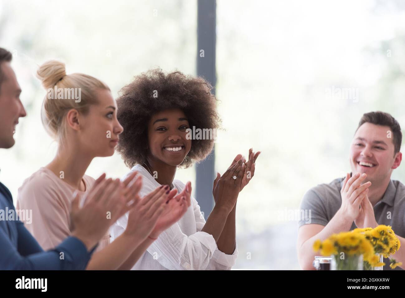 multiethnic Group of young business people looking happy while ...