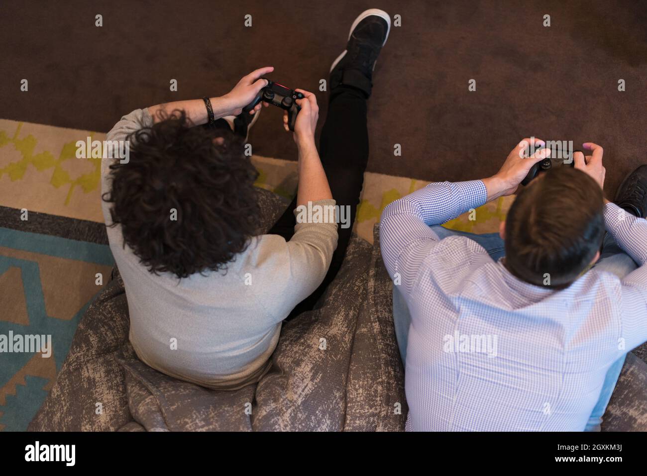 Work hard play hard. Workers Playing computer games in creative startup ...