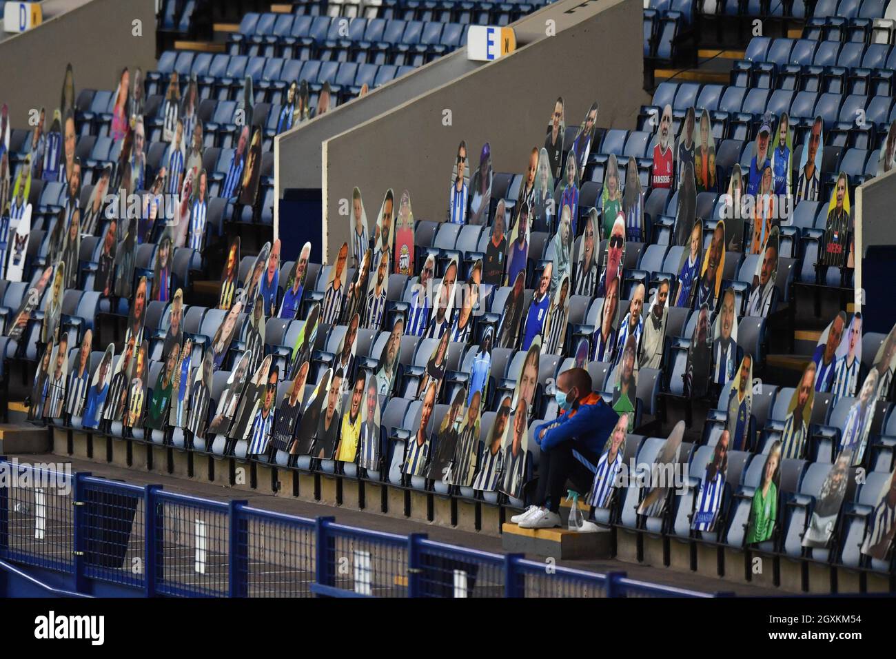 Cardboard cut-outs of fans are seen in the seats as the match is played ...