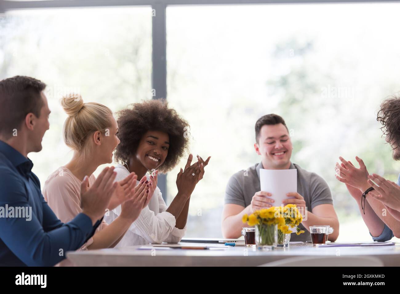 multiethnic Group of young business people looking happy while ...