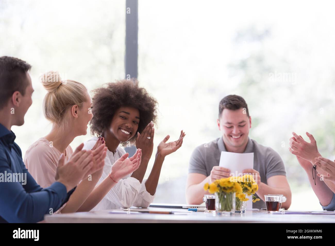 multiethnic Group of young business people looking happy while ...