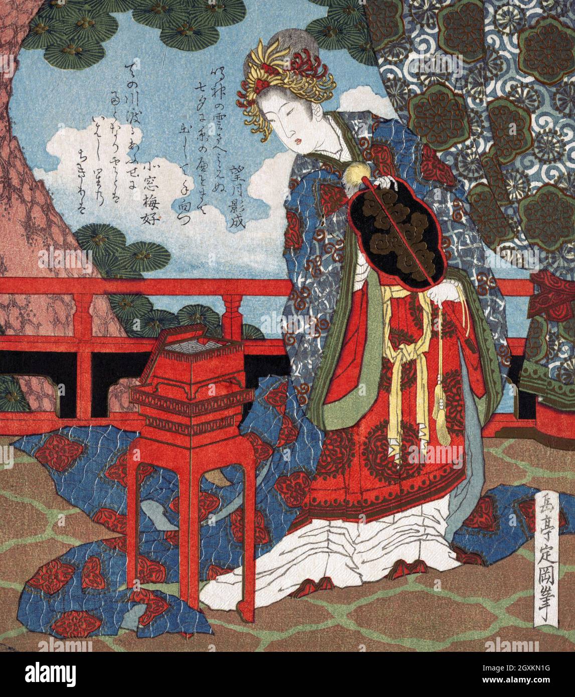 Lady with fan standing on a veranda Stock Photo - Alamy