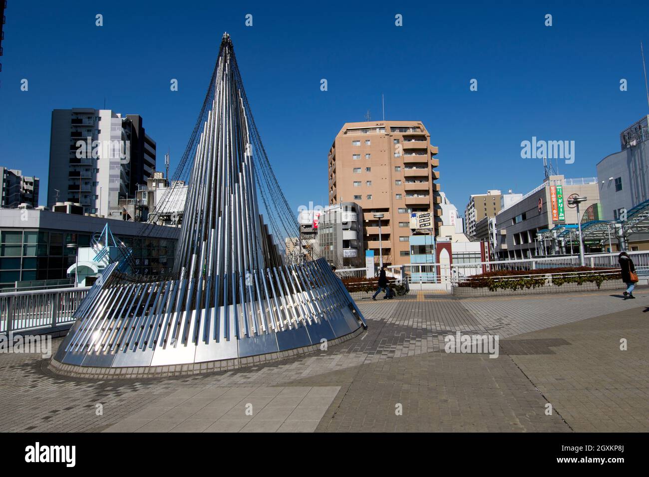 Sculpture of a metal spire outside a train station, Japan Stock Photo ...