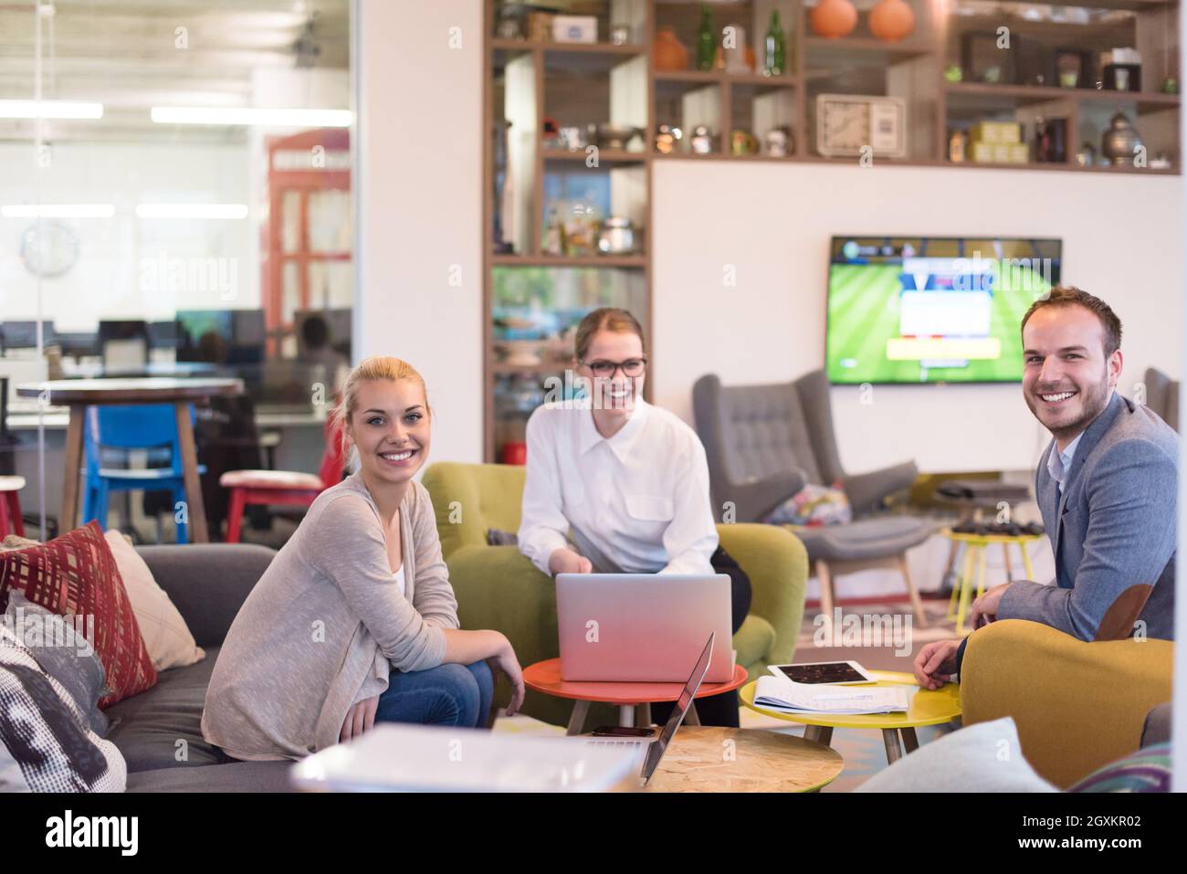 Group of a young business people discussing business plan at modern ...