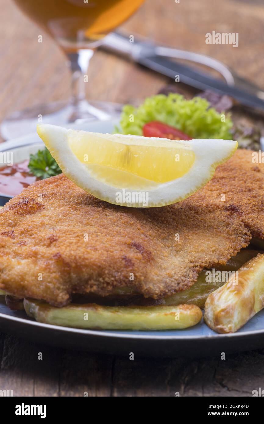 Chicken schnitzel on wood parsley hi-res stock photography and images ...