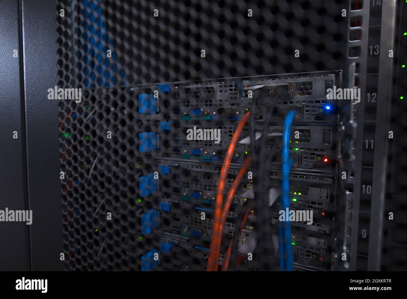 closeup of a modern data center hardware rear side of storage server ...