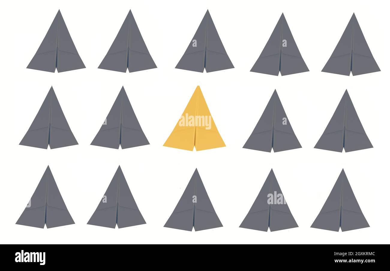 Paper airplanes in different colors on a white background, standing out ...