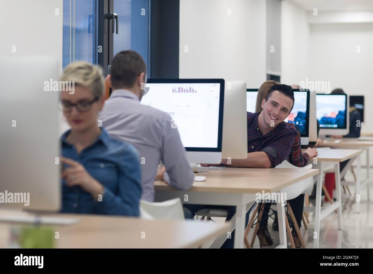 startup business, software developer working on desktop computer at ...
