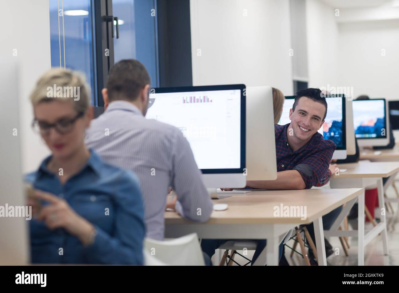 startup business, software developer working on desktop computer at ...
