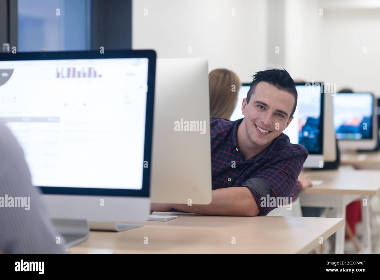 startup business, software developer working on desktop computer at ...