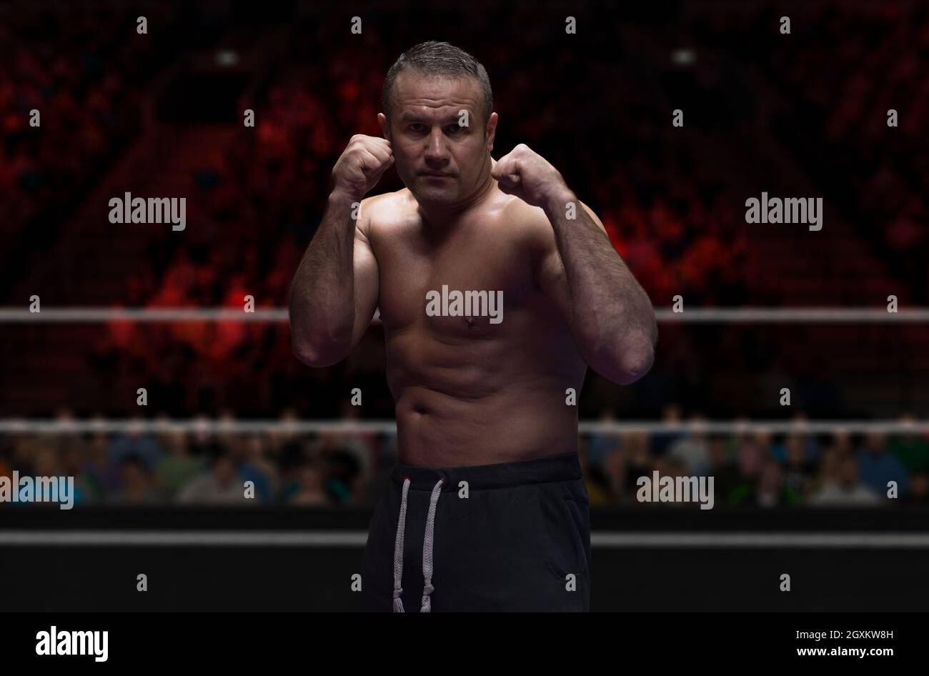 professional kickboxer with hands in martial arts position training for ...