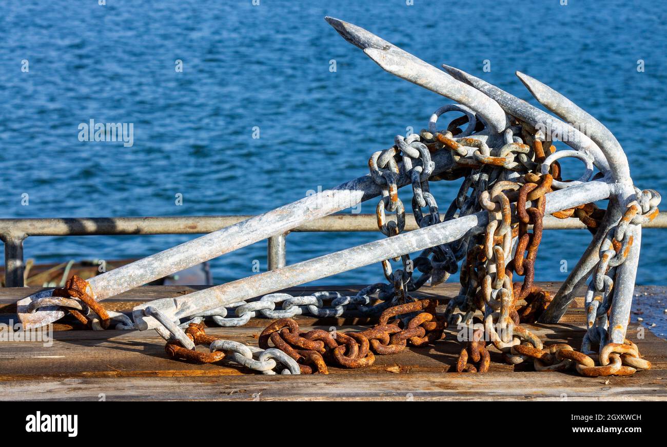 Galvanised Four pronged Fixed Grapnel Anchors Stock Photo - Alamy
