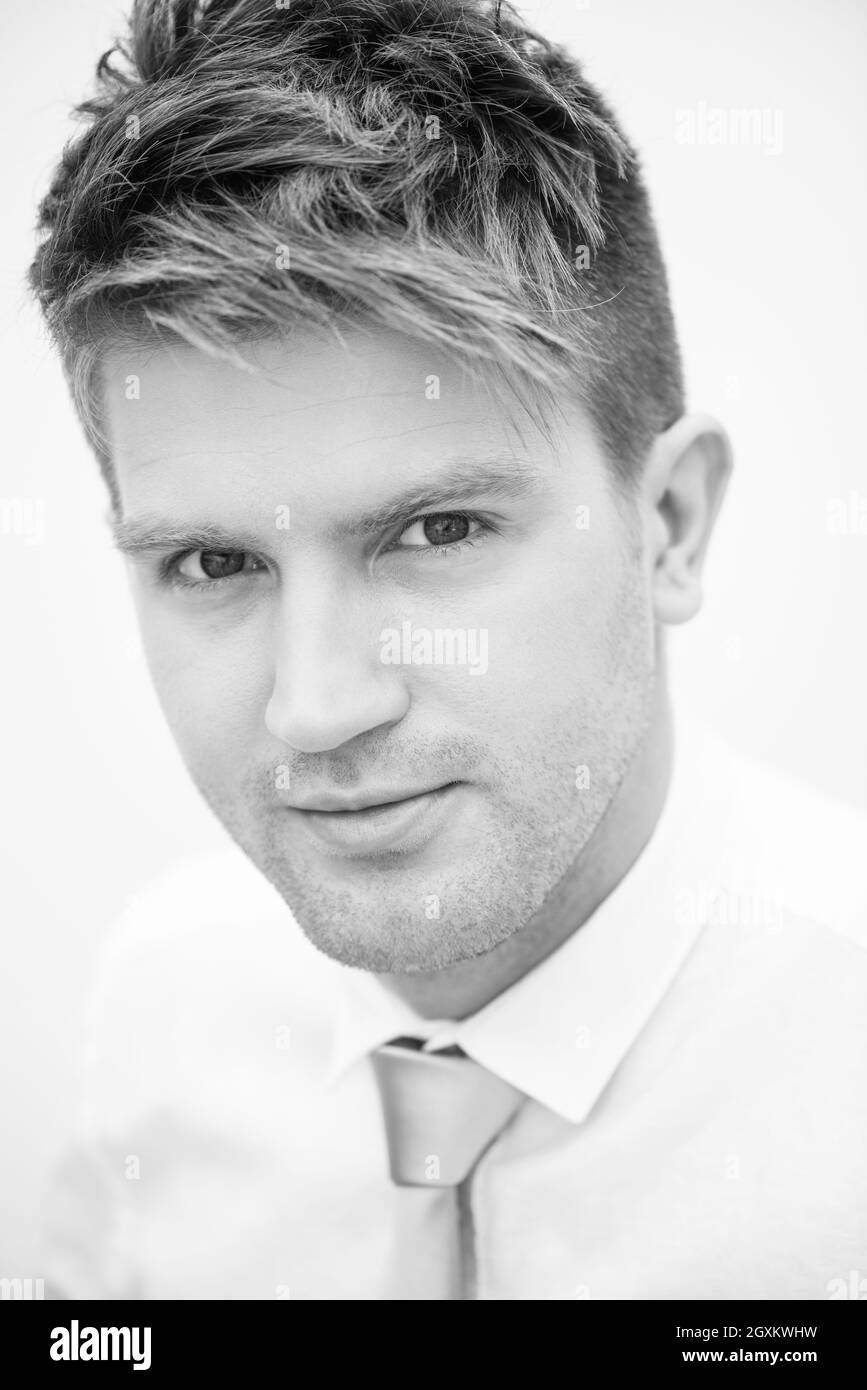 Portrait of a young handsome man in a representative strict clothing ...