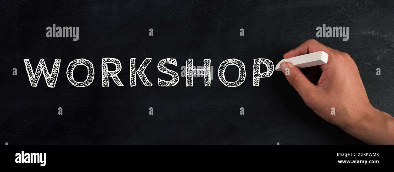 The word workshop is written on a chalkboard,hand with with chalk Stock ...