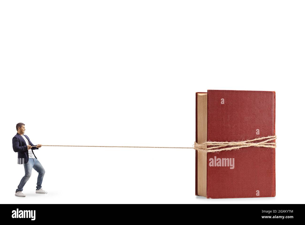 Full length profile shot of a young casual man pulling a giant book ...