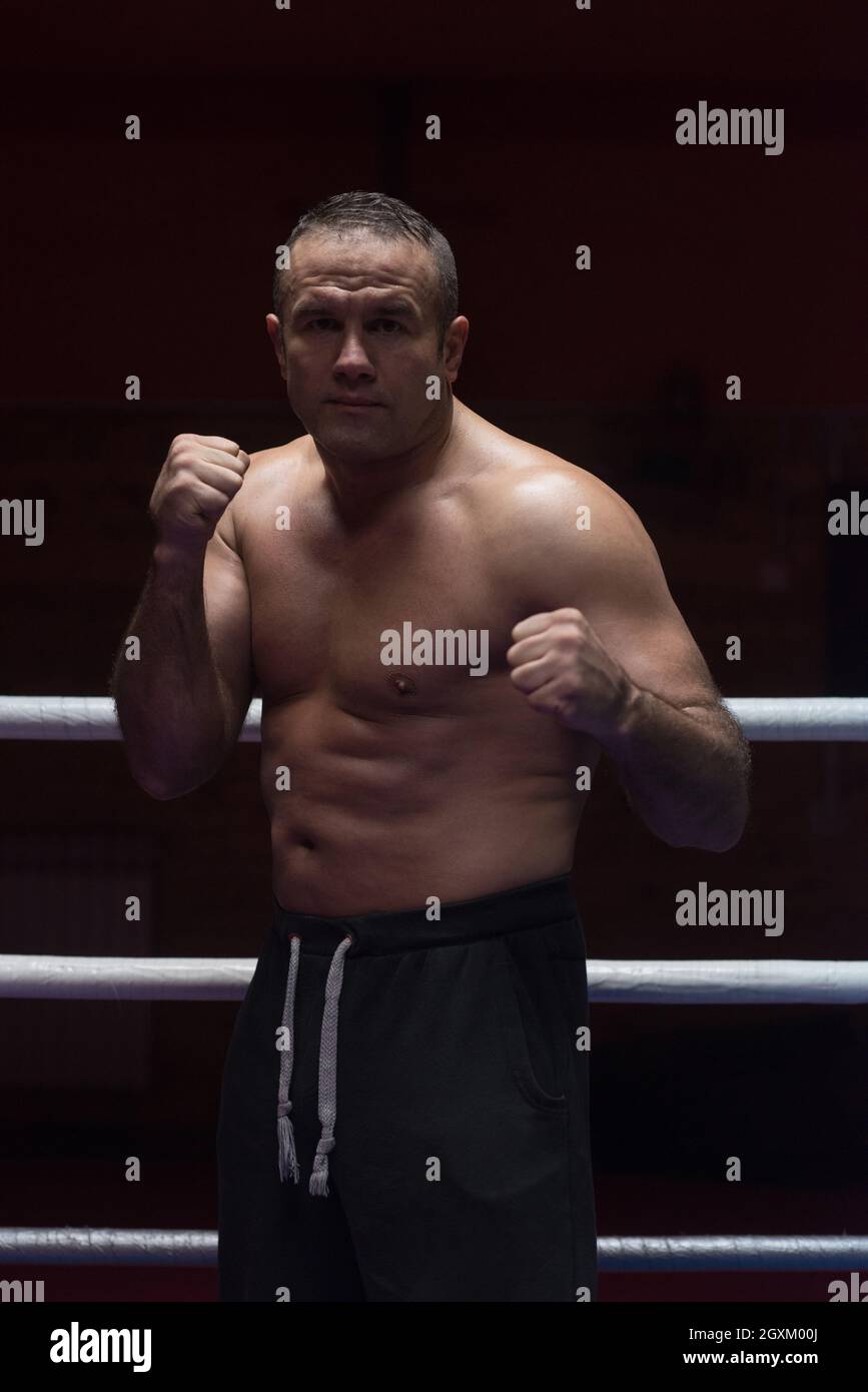 professional kickboxer with hands in martial arts position training for ...