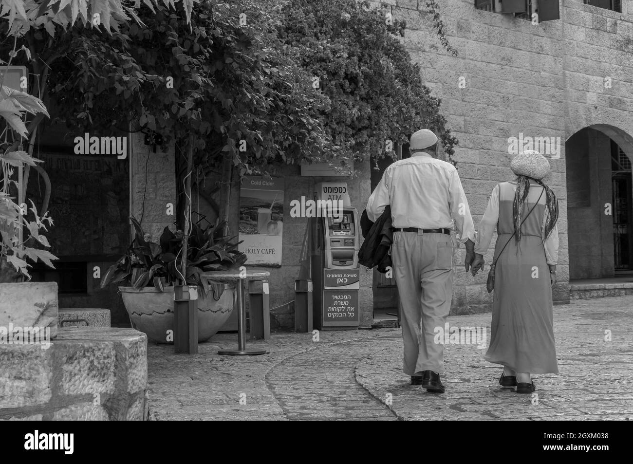 Orthodox Jewish family in traditional clothing on the street of the old ...