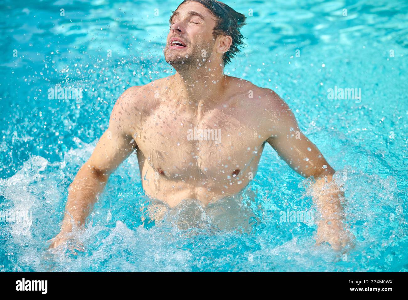 Good looking man in swimming pool hi-res stock photography and images ...