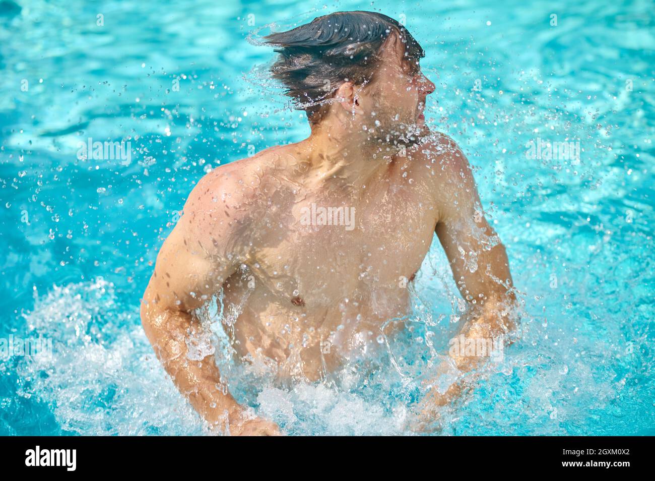 Good looking man in swimming pool hi-res stock photography and images ...
