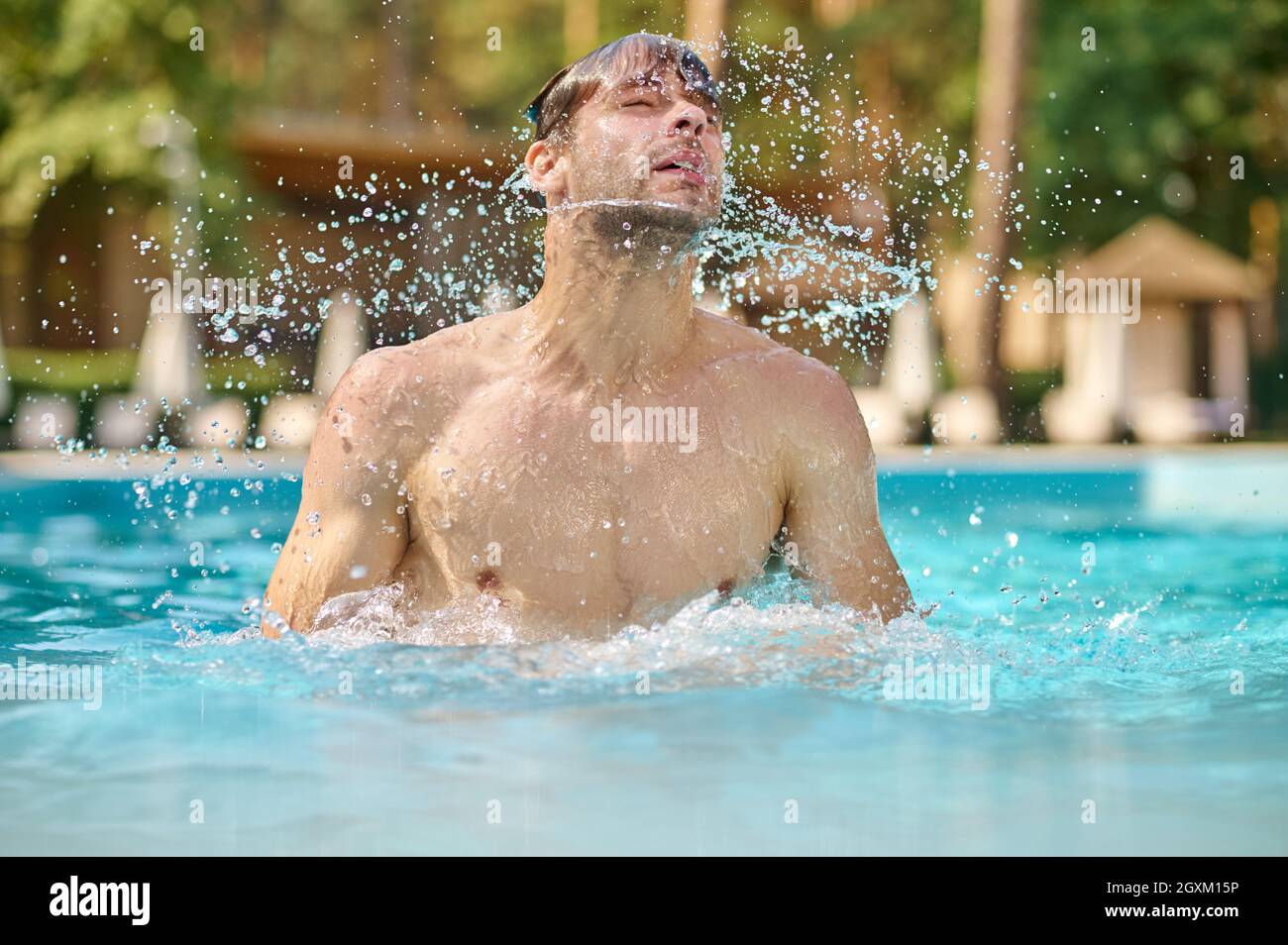 Good looking man in swimming pool hi-res stock photography and images ...