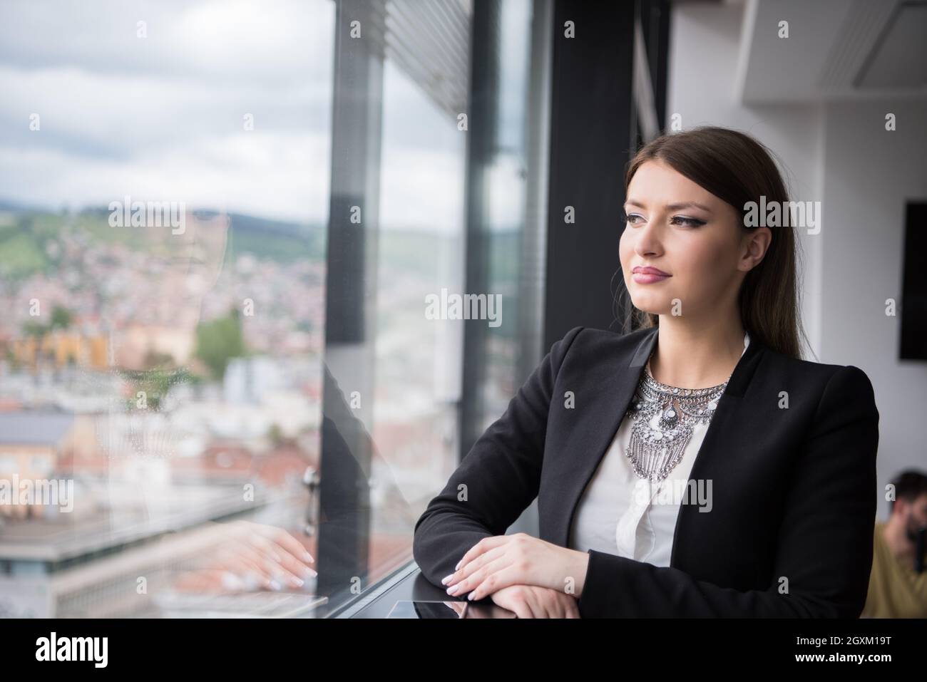 female manager using cell telephone in office interior Stock Photo - Alamy