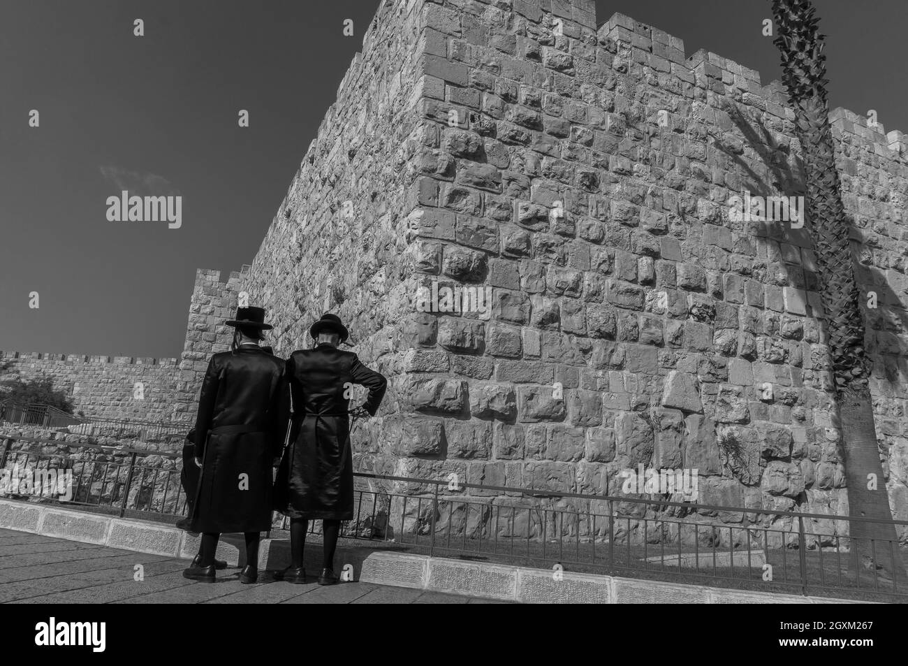 Orthodox Jewish family in traditional clothing on the street of the old ...